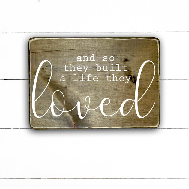 wooden sign | And so they build a life they loved | Old Shack